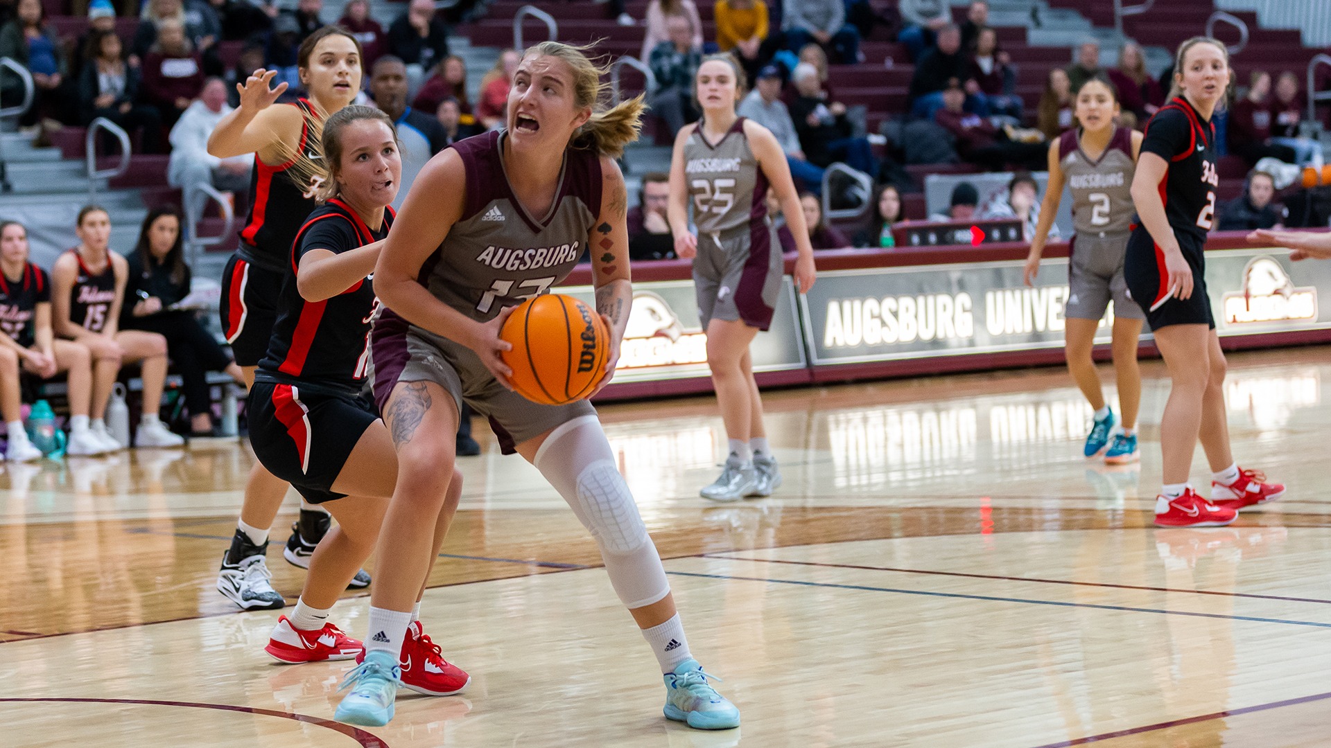Auggies pull away late for season-opening win - Augsburg University ...