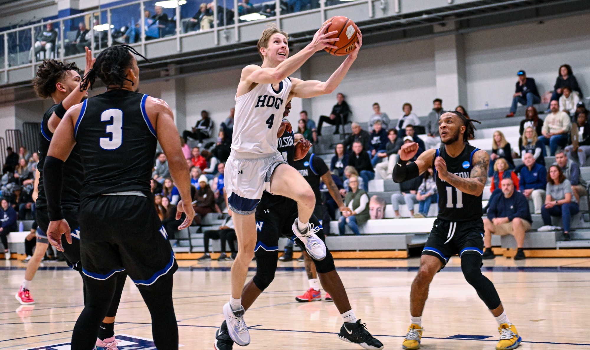 Men’s basketball charges past Bison - Hood College