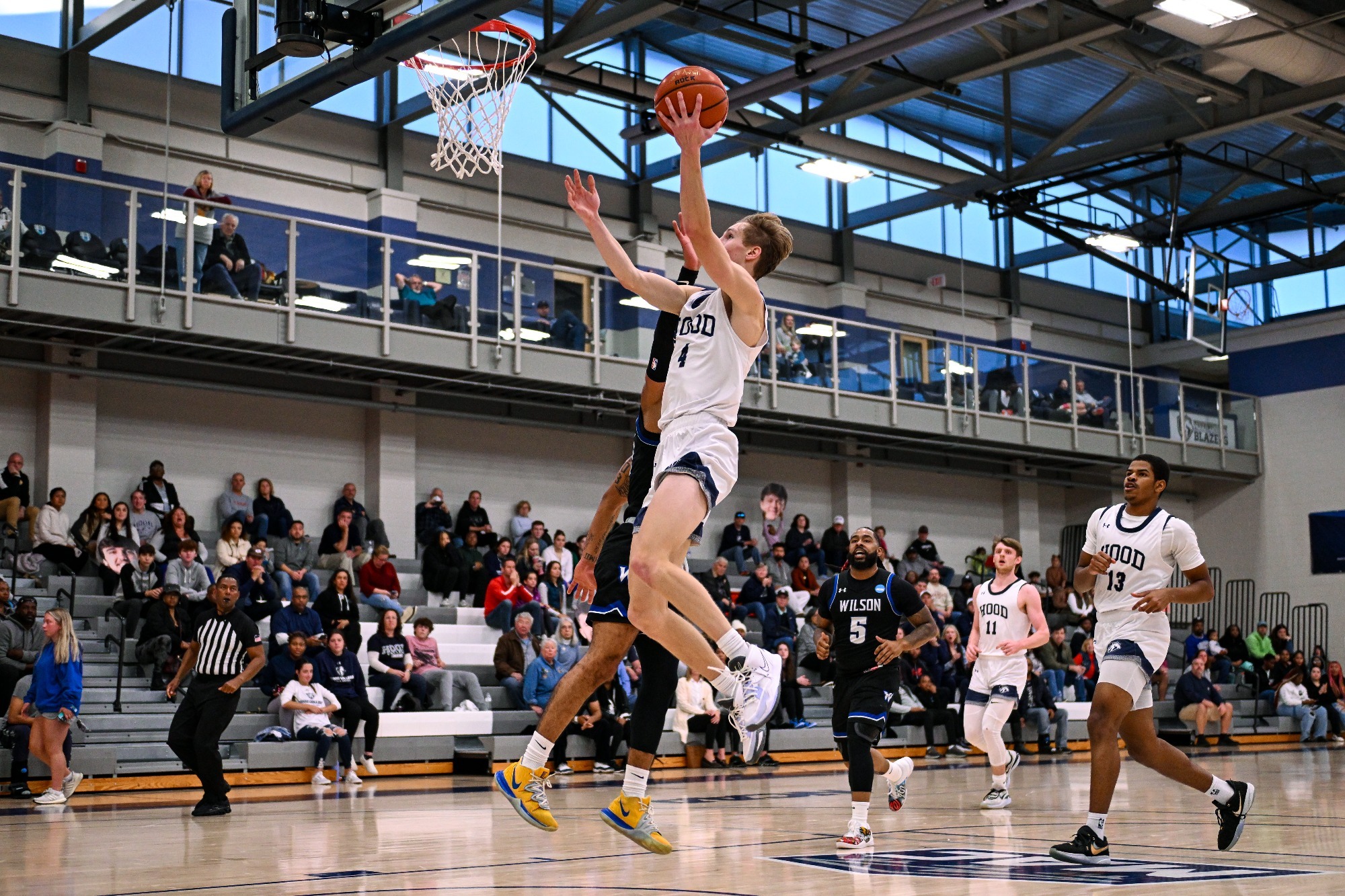 Men’s basketball soars past Messiah - Hood College