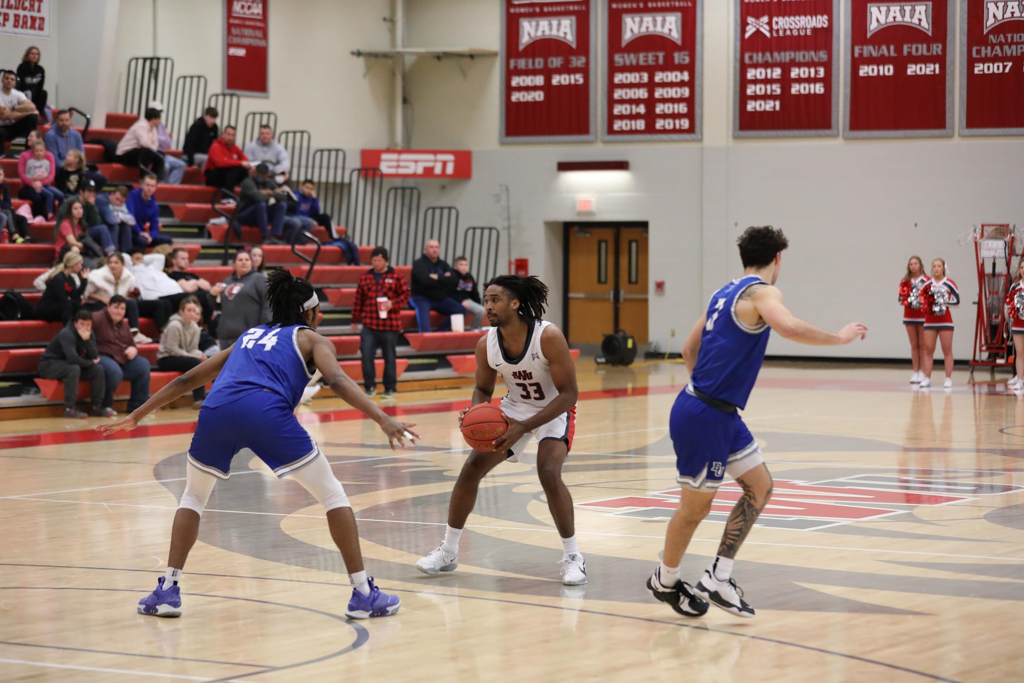 BIG FIRST HALF BY THOMPSON III LEADS NO. 9 MEN'S BASKETBALL PAST BETHEL ...