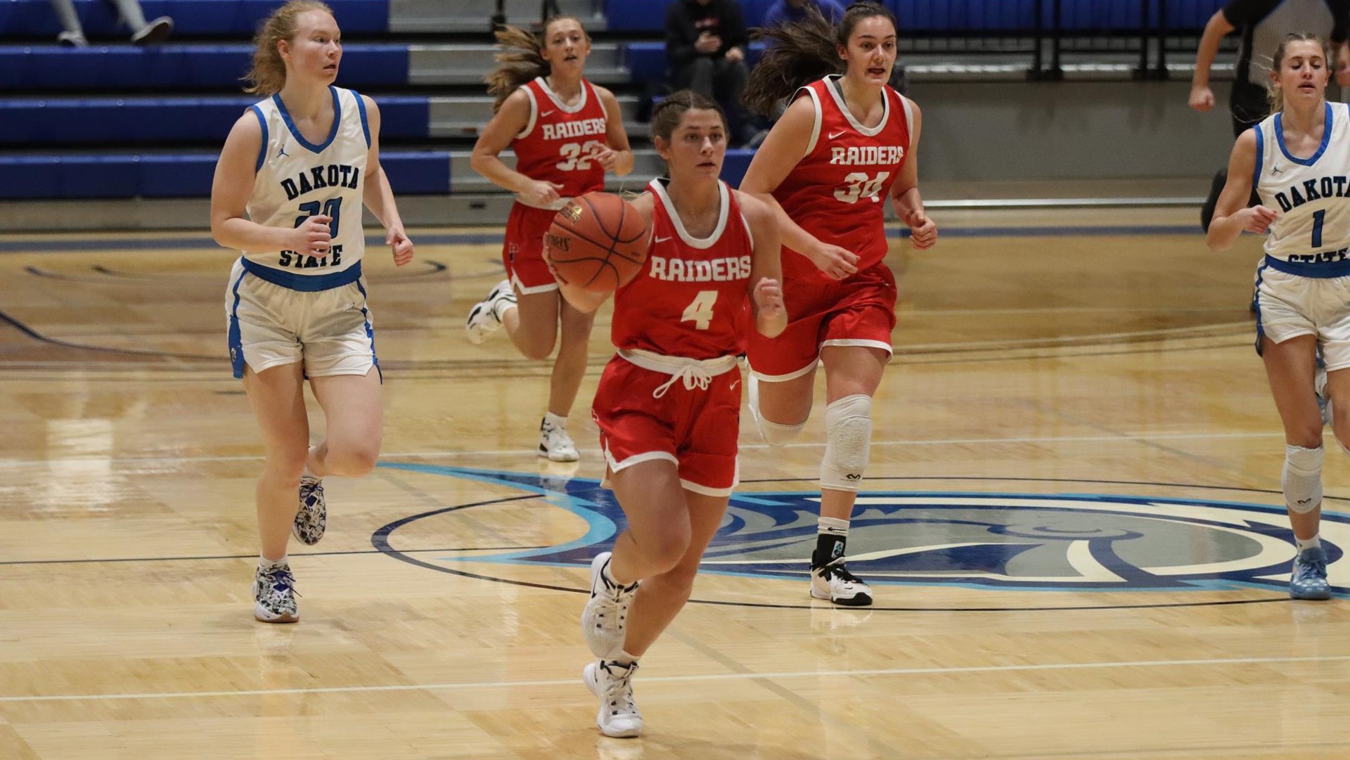 Raiders Win Back-and-Forth Battle with Trojans - Northwestern College ...