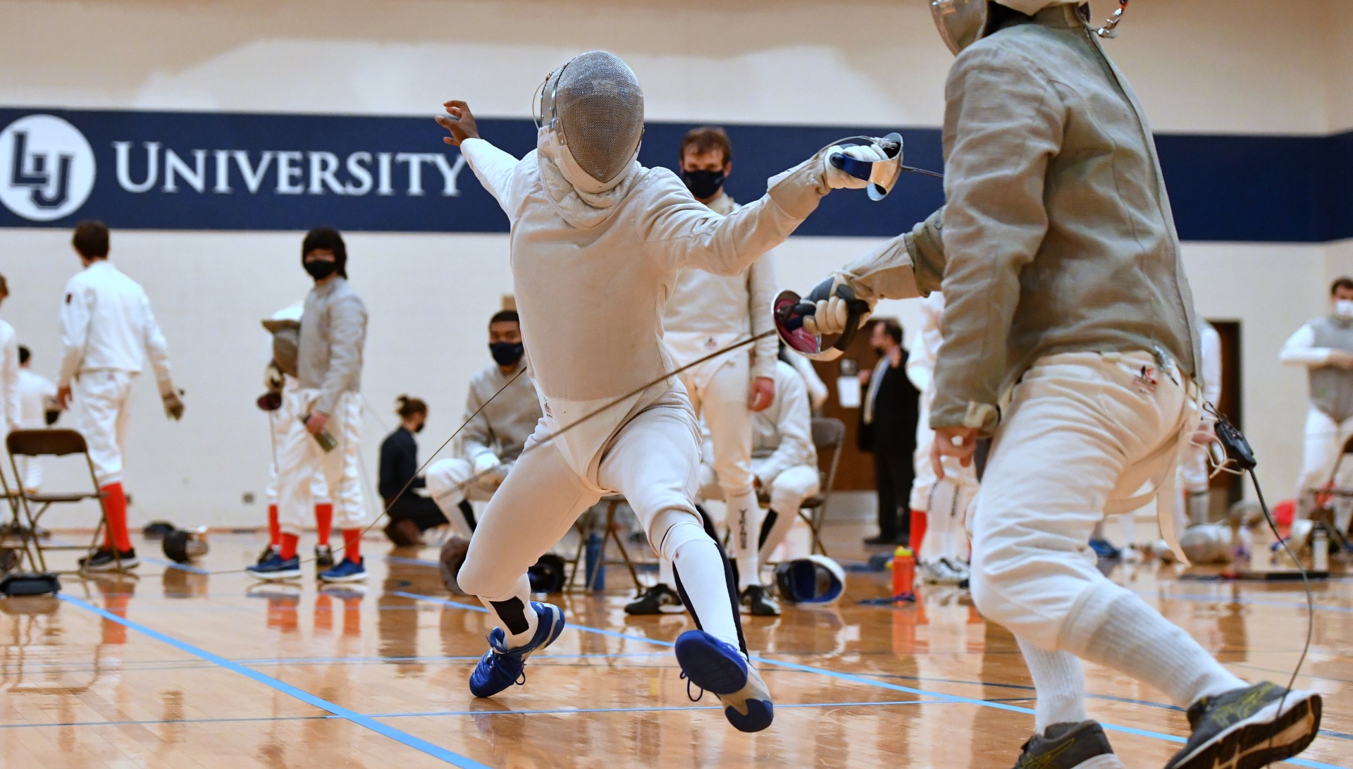 Fencers pick up four dual victories at Northwestern Duals - Lawrence ...