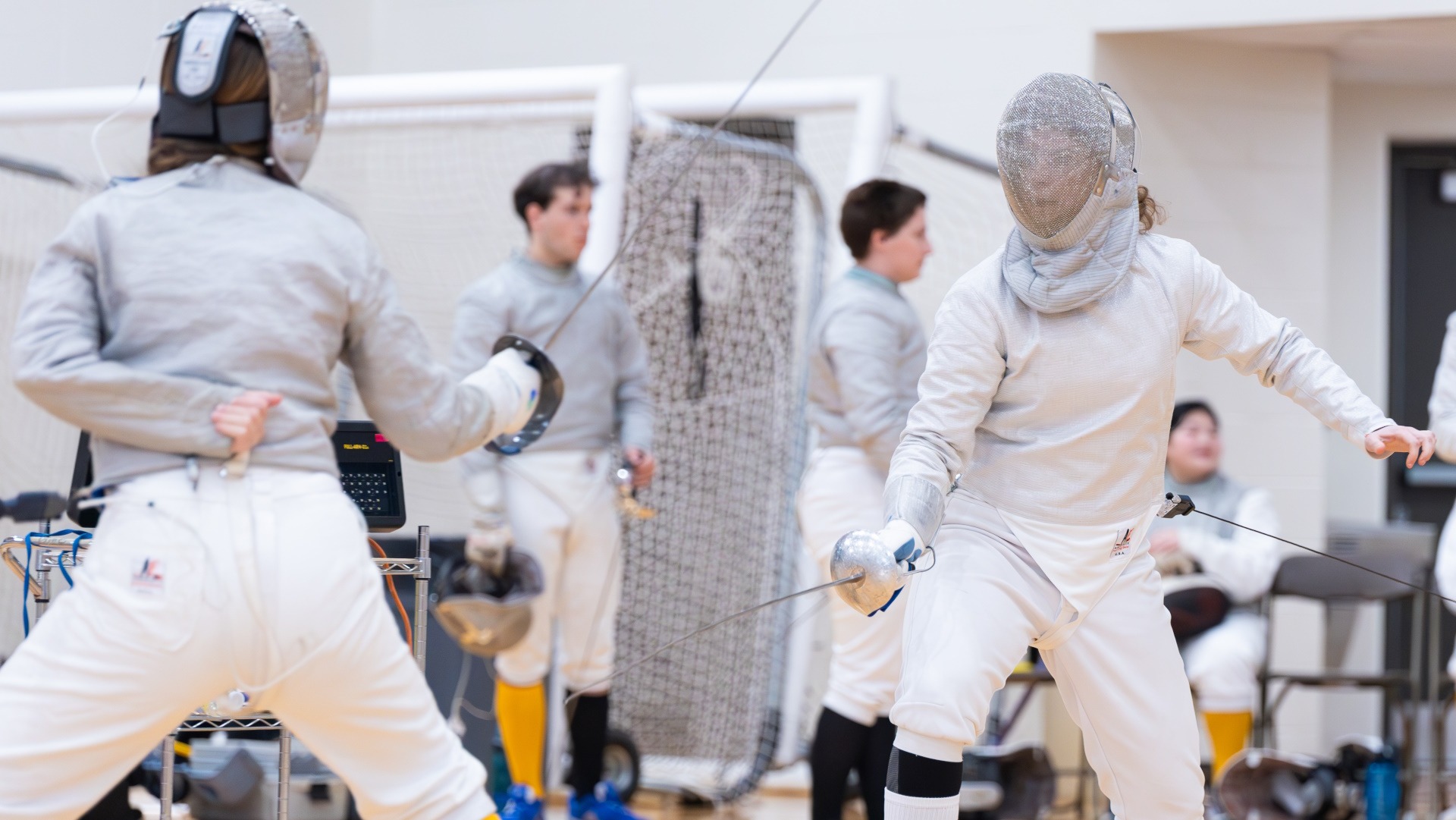 Both fencing teams pick up wins on final day of Northwestern Duals ...